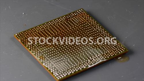 8K close-up of computer CPU chip reballing by soldering iron melting ...